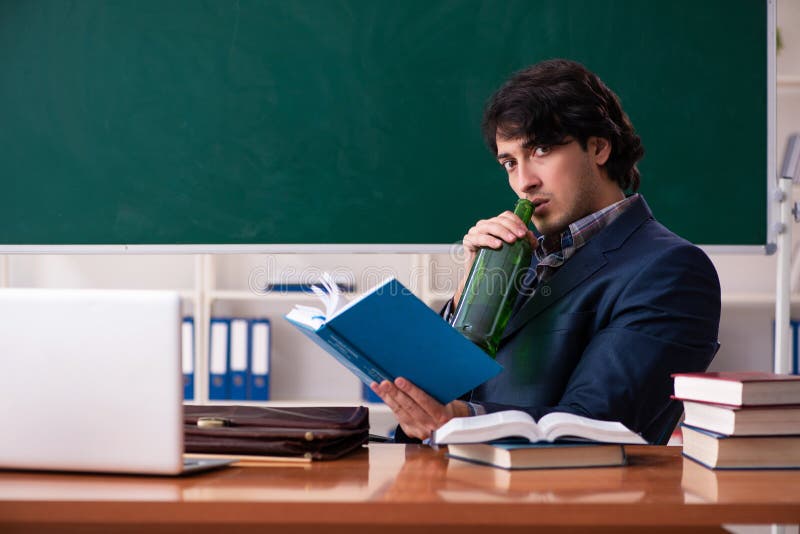 The Male Teacher Drinking in the Classroom Stock Image - Image of ...