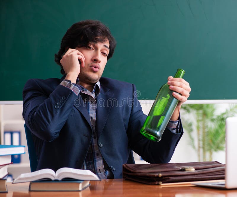 Male Teacher Drinking in the Classroom Stock Image - Image of drink, alcohol: 273816409