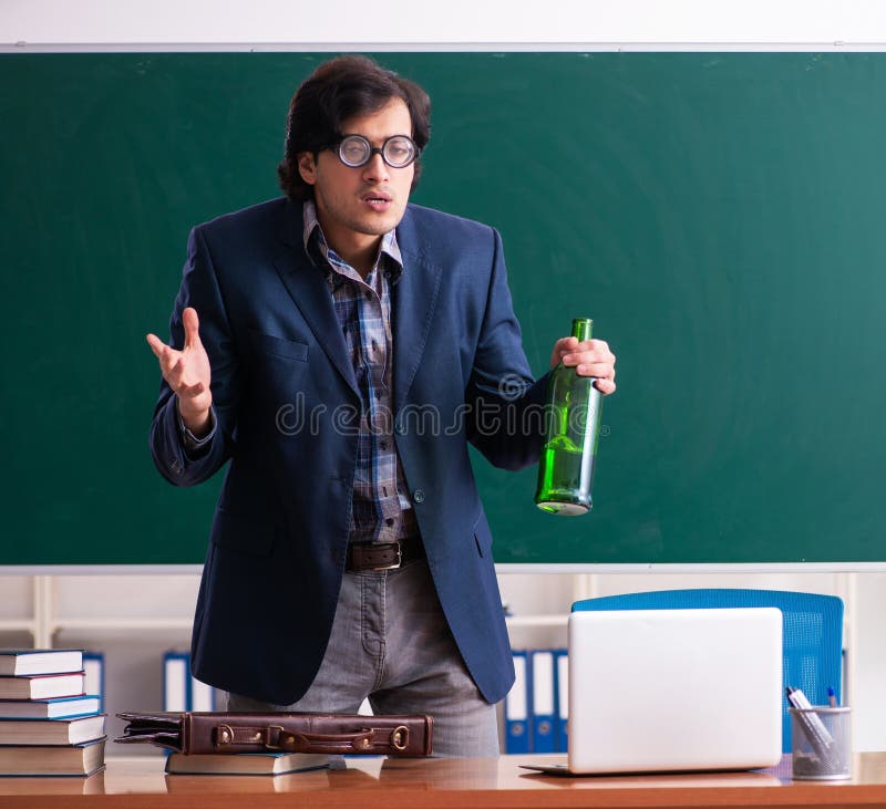 Male Teacher Drinking in the Classroom Stock Photo - Image of classroom ...