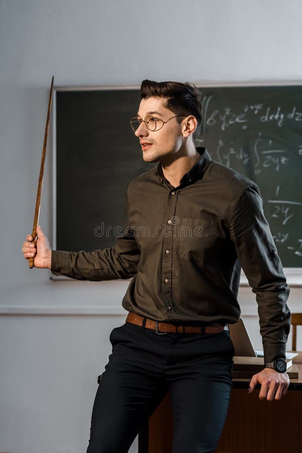 Male Teacher in Formal Wear and Glasses Holding Wooden Pointer and ...