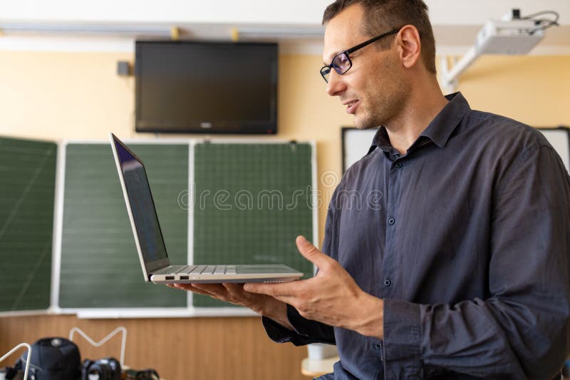Male Teacher Having Online Class through Video Call and Explaining ...