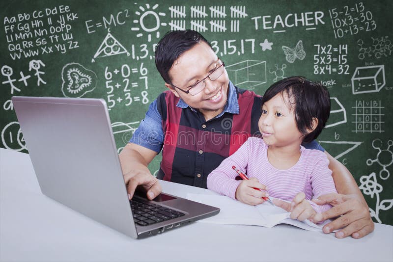 Male Teacher Helping His Student To Learn Stock Image - Image of book ...
