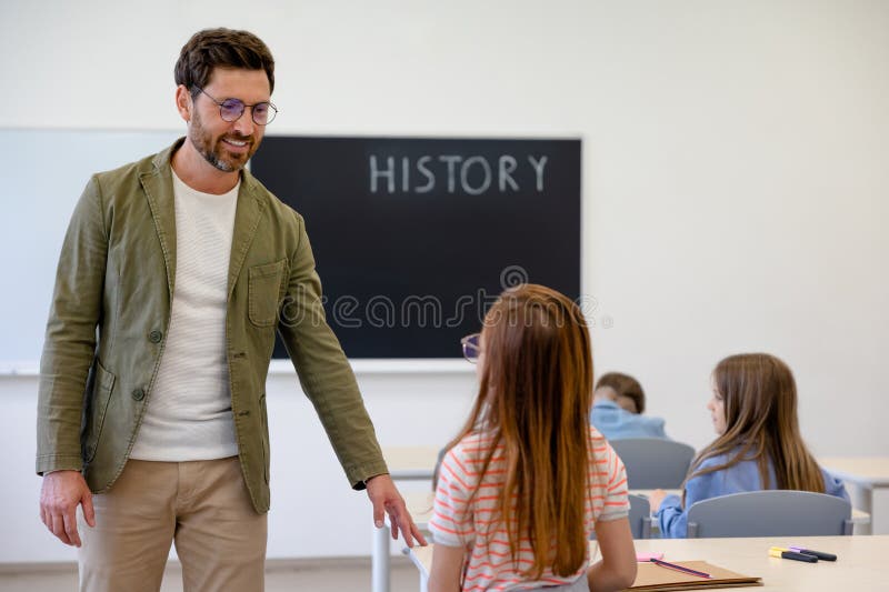 Male Teacher and the Kids at the History Lesson Stock Photo - Image of ...