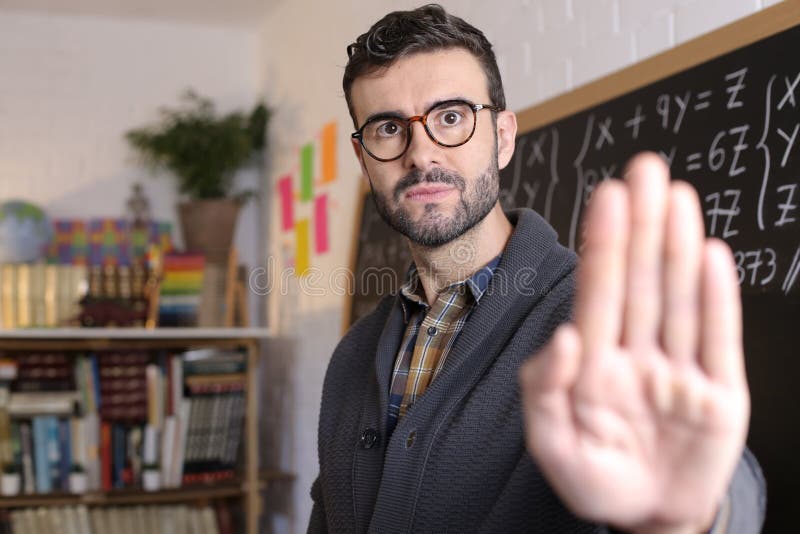 Male Teacher Showing Stop Sign with Hand Gesture Stock Image - Image of ... Male Teacher Showing Stop Sign with Hand Gesture Stock Image - Image of ...