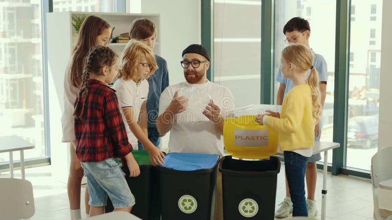 Male Teacher Teach How To Sort the Rubbish. Garbage Sorting Class, a ...
