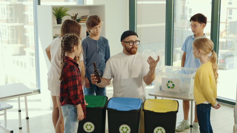 Male Teacher Teach Where To Sort the Rubbish. Garbage Sorting Class ...