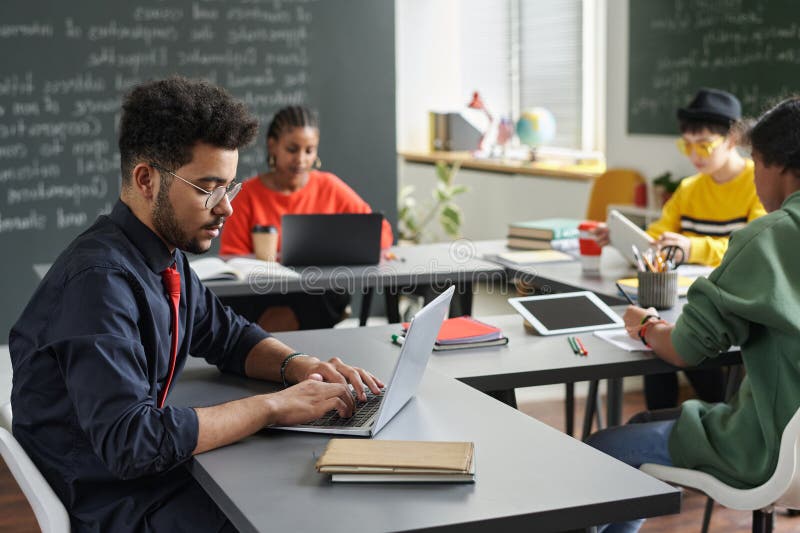 Male Teacher Using Laptop Side View Stock Image - Image of diversity ...