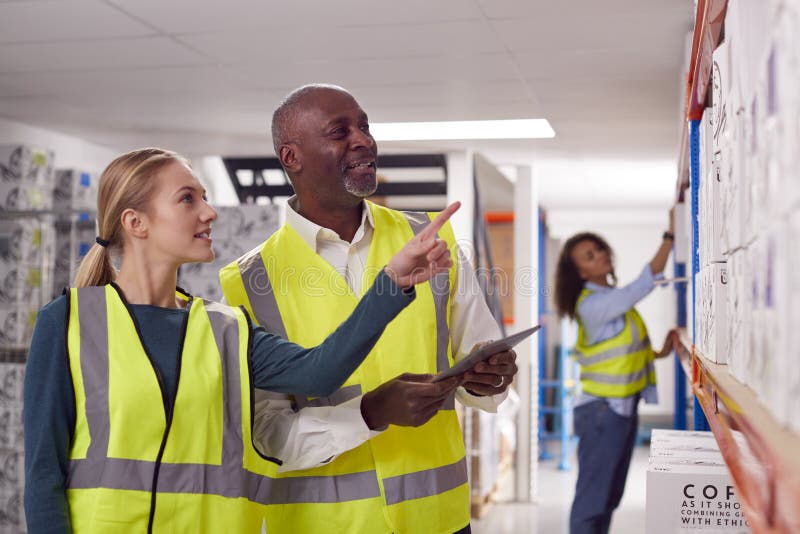 Male Team Leader with Digital Tablet in Warehouse Training Intern ...