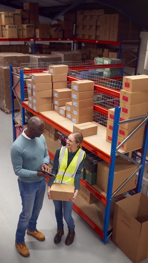 Male Team Leader with Digital Tablet in Warehouse Training Intern ...