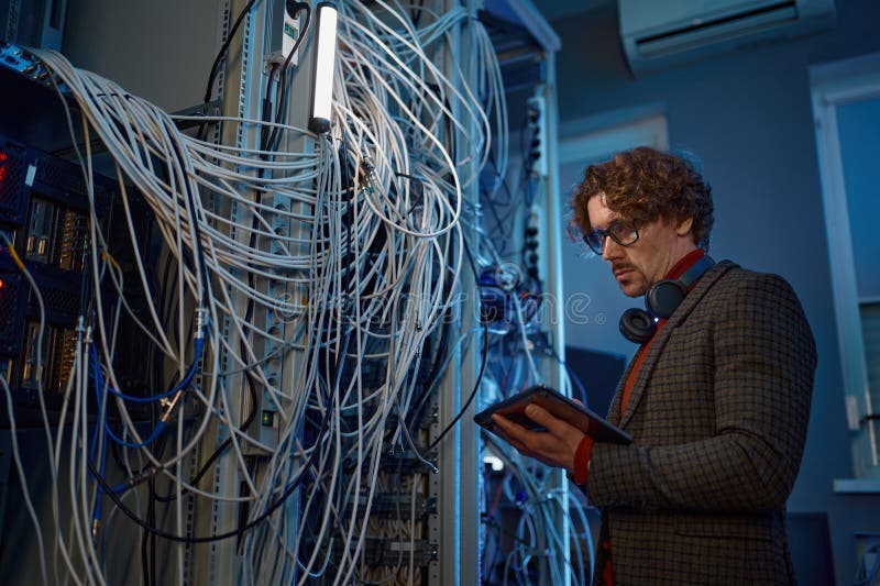 Male it Technical Specialist Makes a Diagnosis in Server Room Stock ...