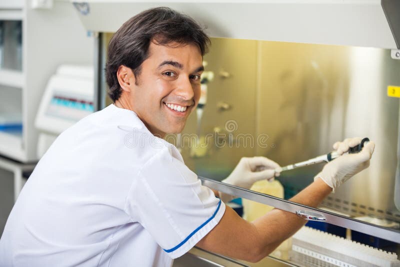 Male Technician Experimenting in Laboratory Stock Photo - Image of ...