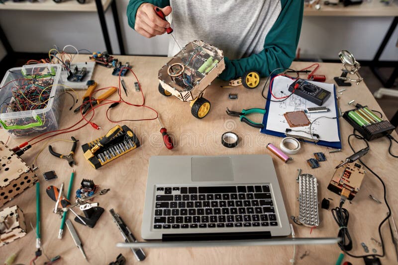 Male it Technician Fixing Broken Wheel Robot Stock Image - Image of ...
