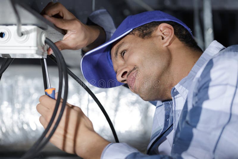 Male Technician Fixing Cables Stock Photo - Image of appartment ...