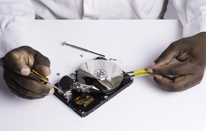 Male Technician Hand Holding and Working on Computer Hard Drive with ...