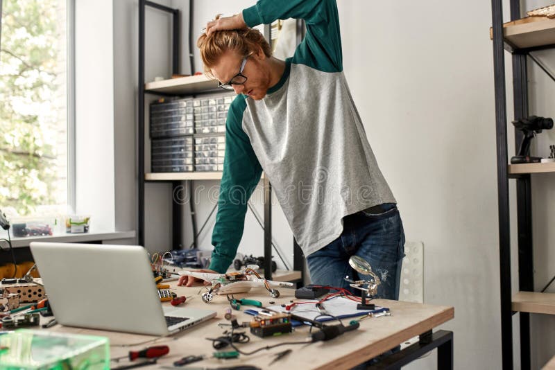 Male it Technician Looking at Disassembled Drone Stock Photo - Image of ...