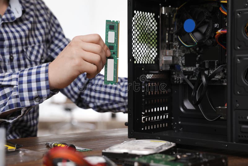 The Technician is Putting the CPU on the Socket of the Computer ...