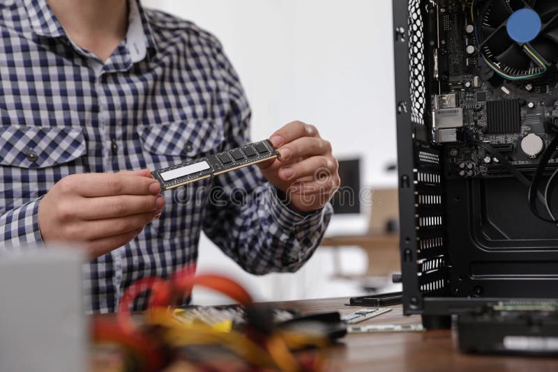 Male Technician Repairing Computer at Table Stock Photo - Image of ...