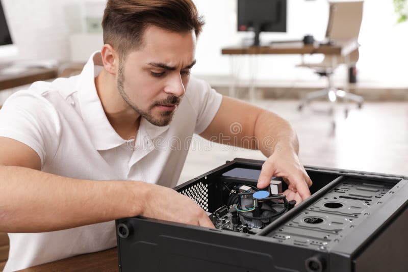 Male Technician Repairing Computer at Table Stock Image - Image of ...