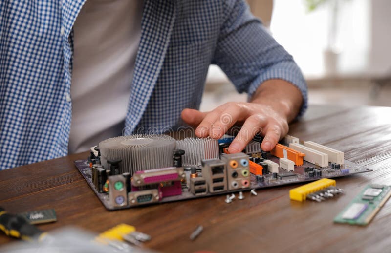 Male Technician Repairing Motherboard at Table Stock Image - Image of ...
