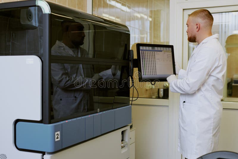 Operating High-Tech Laboratory Equipment in Modern Facility Stock Photo ...