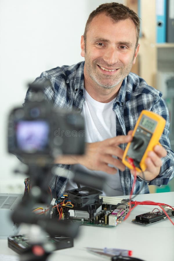 Male Technician Using Camera To Make Tutorial Stock Photo - Image of ...