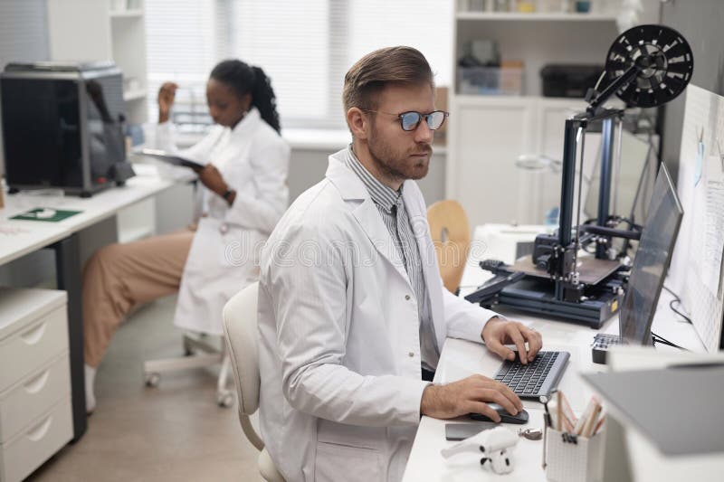 Male Technician Using Computer in 3D Printing Lab Stock Image - Image ...