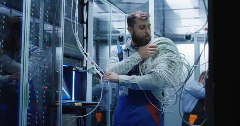 Male Technicians Working in a Data Center Stock Photo - Image of ...