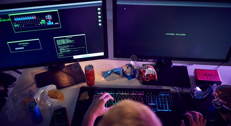 Male Teenage Hacker Sitting in Front of Computer Screens Bypassing ...