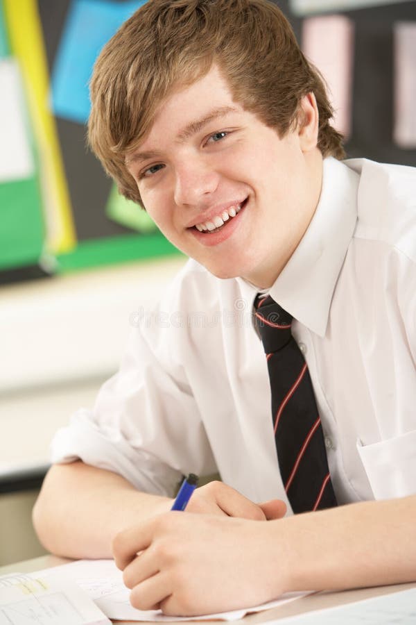 Male Teenage Student Studying Stock Image - Image of listening ...