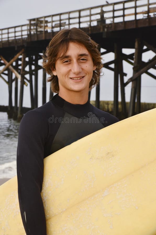 Male Teenage Surfer stock photo. Image of wave, splash - 26755278