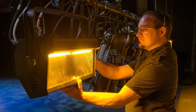 Male Theater Technician Adjusting Gear Stock Image - Image of ...