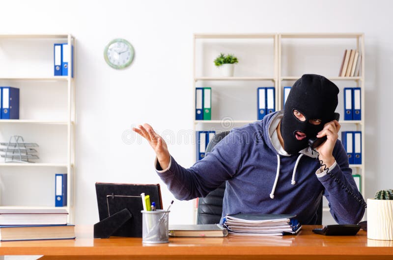 The Male Thief in Balaclava in the Office Stock Photo - Image of ...