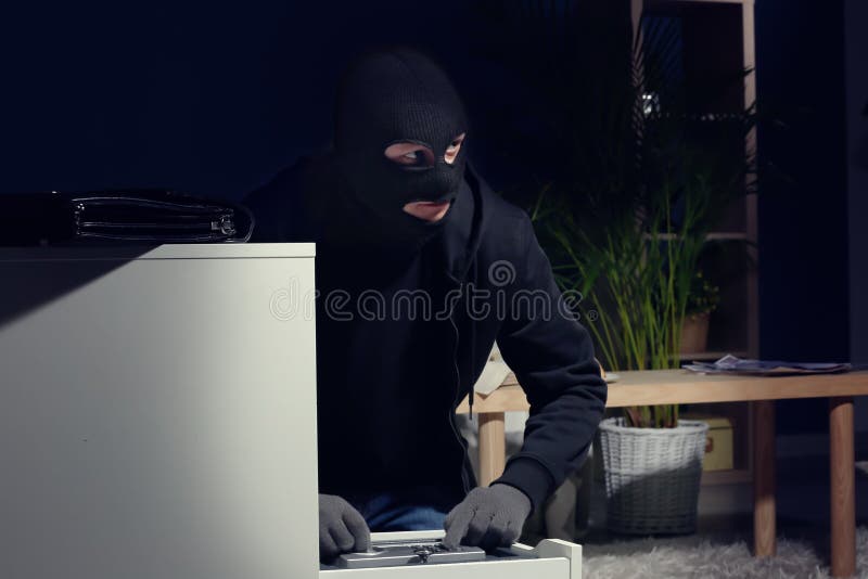 Thief Breaking Lock To Open The Gate. Male Thief Trying To Open Gate ...