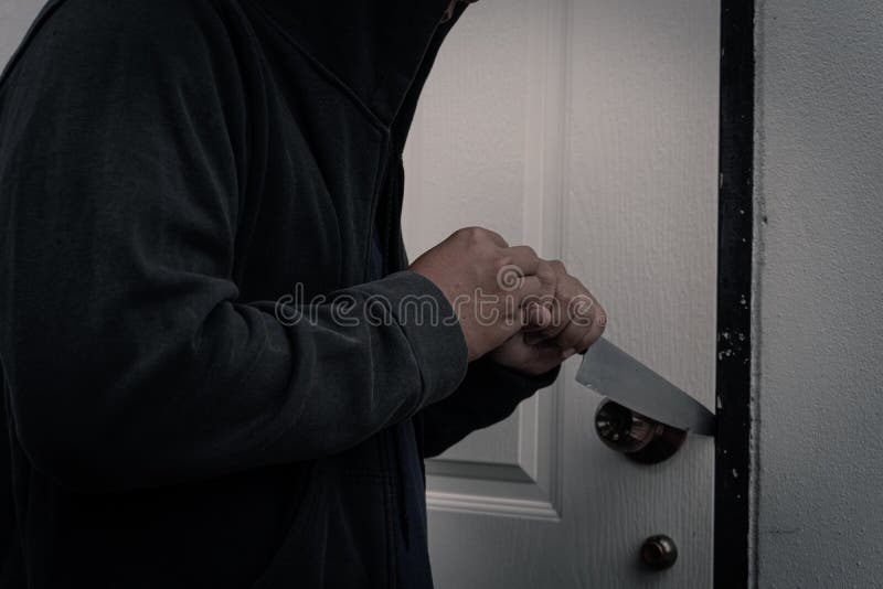 Male thief opening door stock image. Image of crime - 242797597