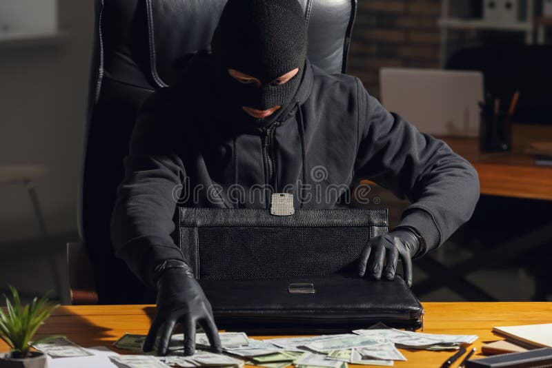 Thief Stealing Money Stock Images - Download 3,028 Royalty Free Photos