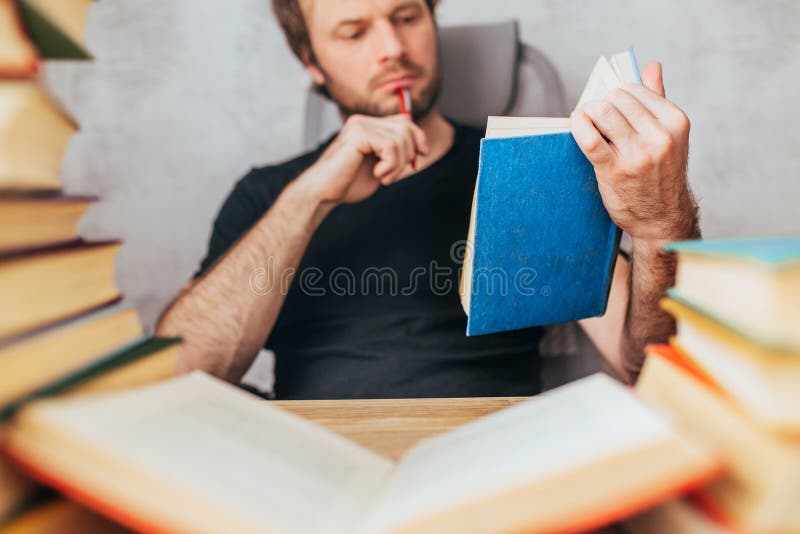 Male Thinker Philosopher Thoughtfully Reads into the Pages of an Old ...