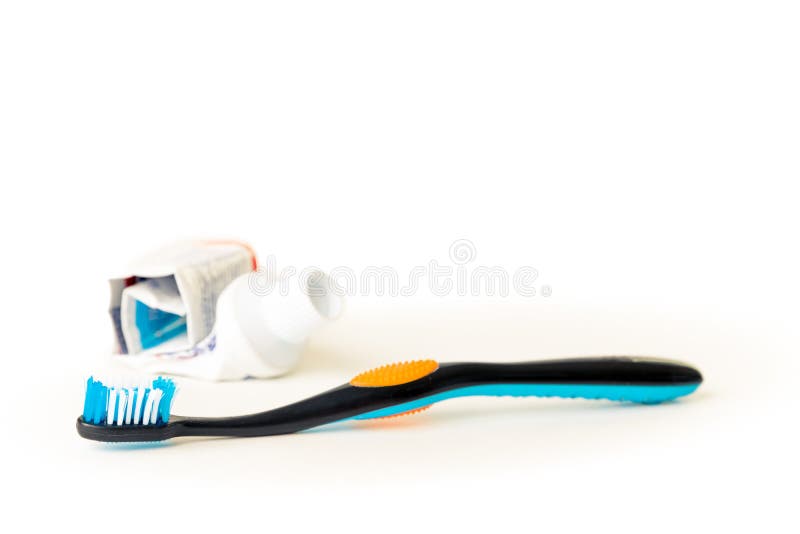 A Male Toothbrush with an Empty Rolled Up Toothpaste Sqeeze Stock Photo ...