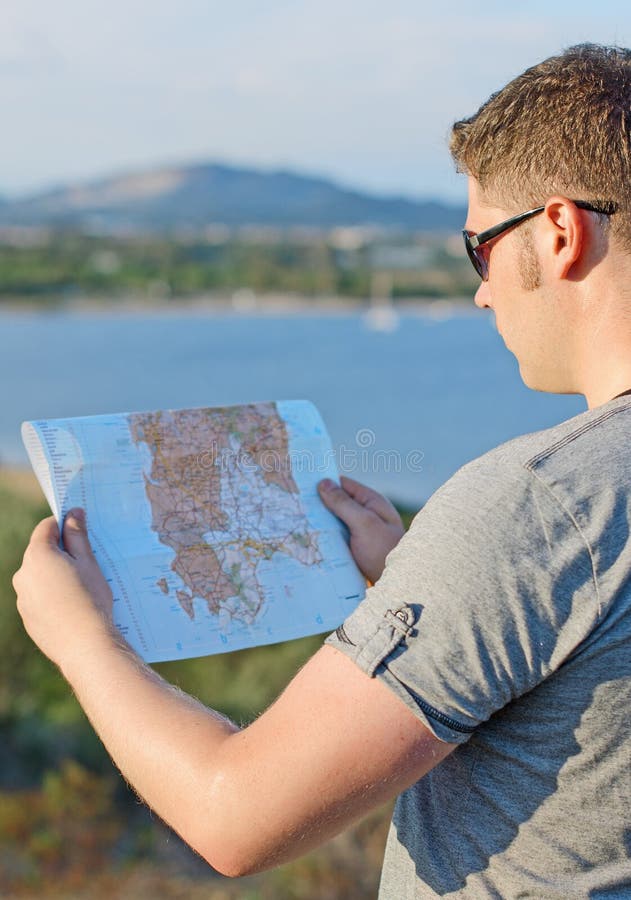 Male tourist with map stock photo. Image of hill, leisure - 37534400
