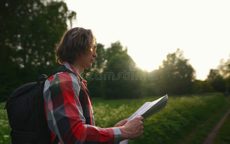 Male tourist with map stock photo. Image of cartography - 220873932