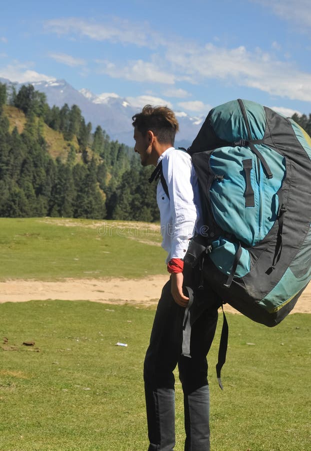 A Male Tourist with Parachute Backpack in the Mountain Stock Photo ...