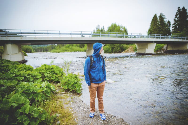 Male Tourist Standing beside the Mountain River Stock Photo - Image of ...