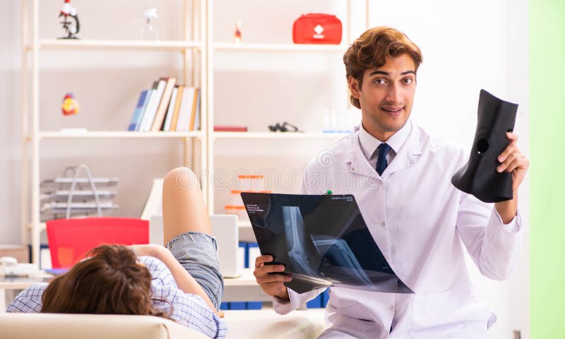 Male Traumatologist Looking at Xray Images Stock Photo - Image of ...