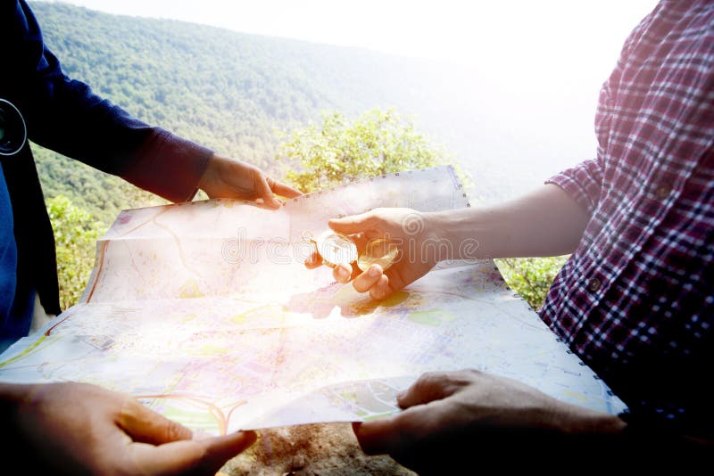 Male Traveler Holding a Compass and Looking the Map Stock Image - Image ...