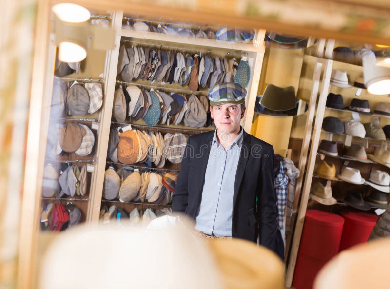 Male Try on Hat and Looking at Mirror in Dressing Room Stock Image ...