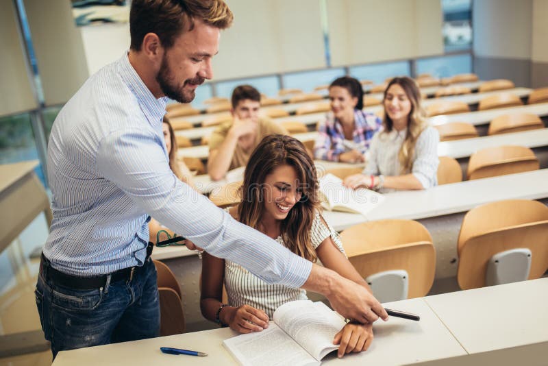 Tutor Teaching University Students in Classroom Stock Image - Image of ...