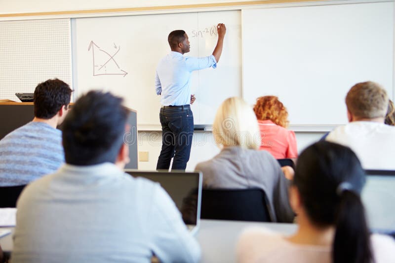 Teenage Students Studying In Classroom With Tutor Stock Photo - Image ...