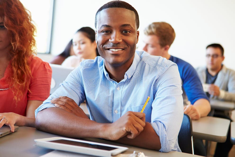 Male University Student Using Digital Tablet in Classroom Stock Photo ...