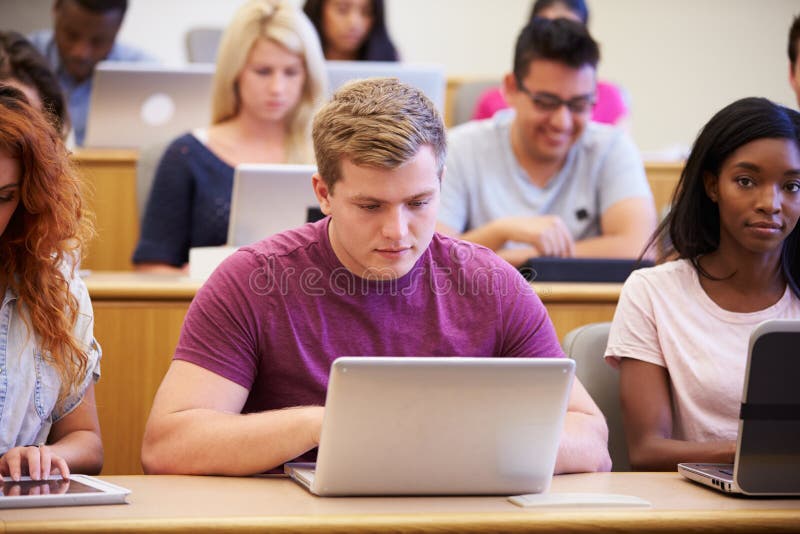 Male University Student Using Laptop in Lecture Stock Image - Image of ...