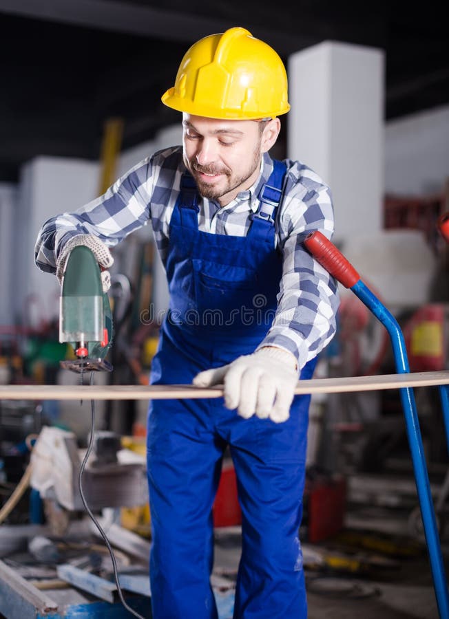 Male is Using Power Jigsaw for Construction Work Stock Photo - Image of ...