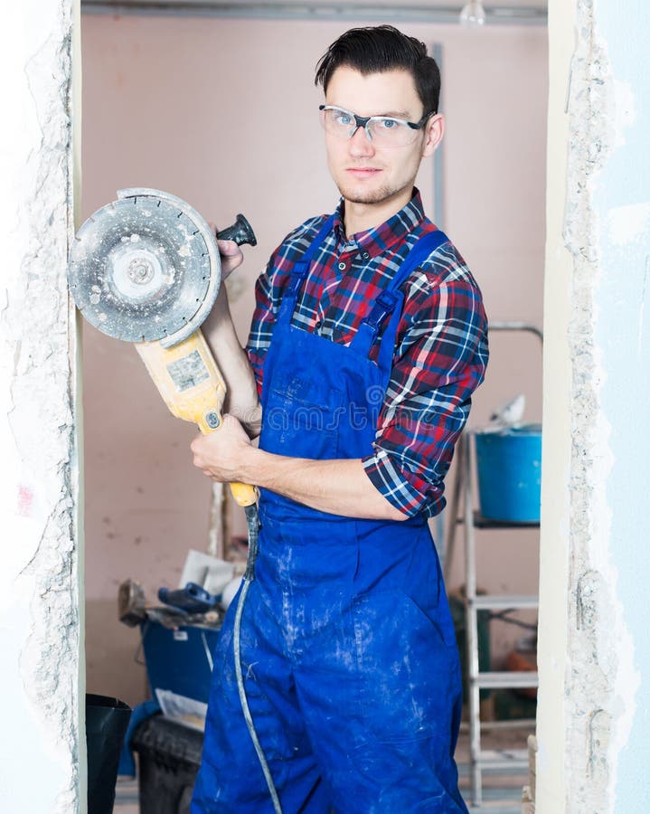 Male Using Professional Angle Grinder Stock Photo - Image of builder ...